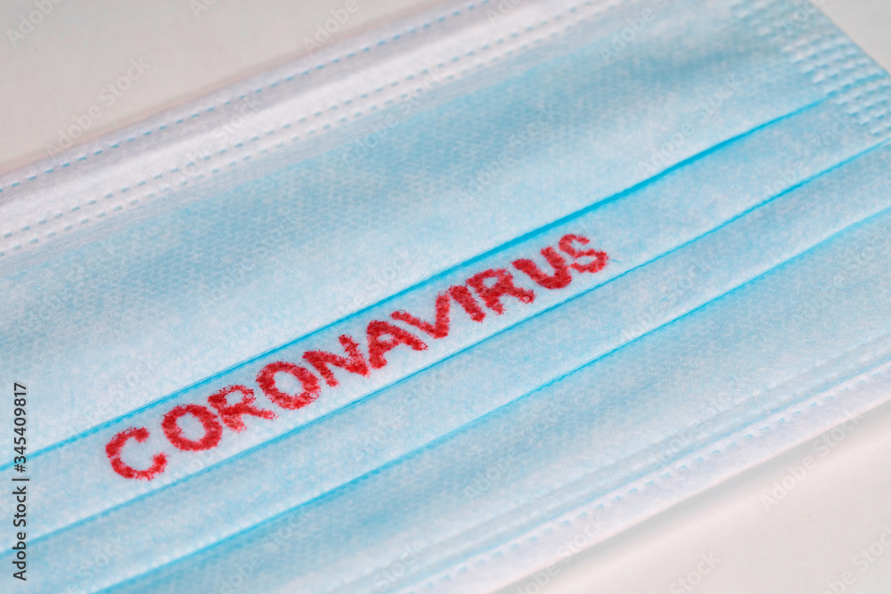 COVID-19. Facial masks on the pile. Epidemic background. Shortage of ...