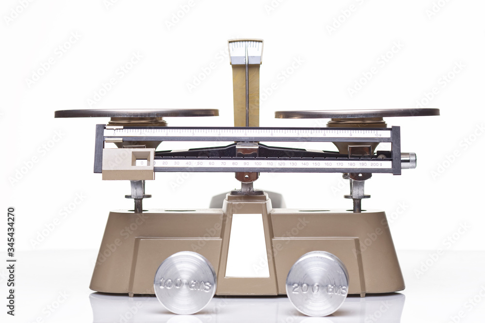 A triple beam balance used to measure the mass of materials. Stock ...