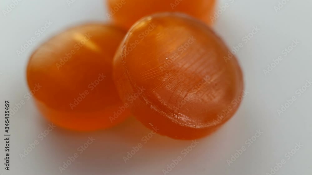 Brown sweet lozenge for sore throat on white background. Pastilles ...
