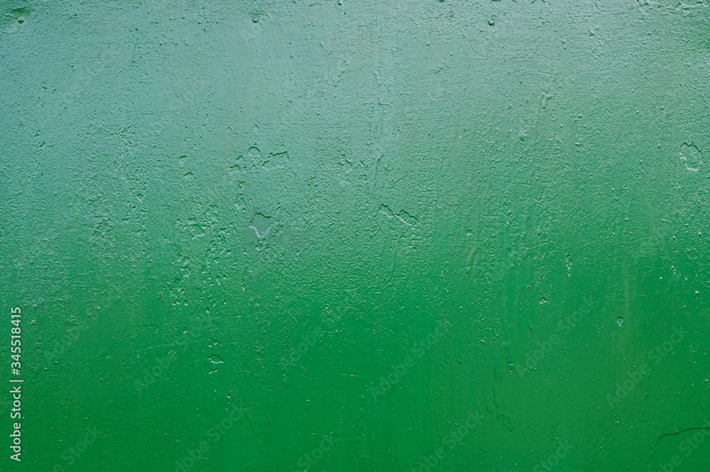 green metal background. poured paint. metal texture can be used as ...