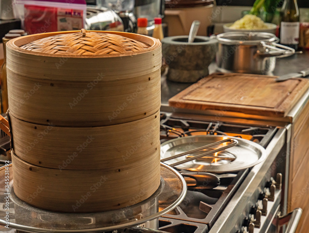 Close up shot of a Japanese cooking Steamer. The steamer stands on top ...