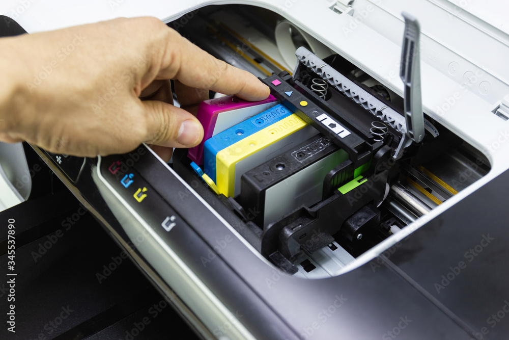 Technicians are install setup the ink cartridge of a inkjet printer the ...