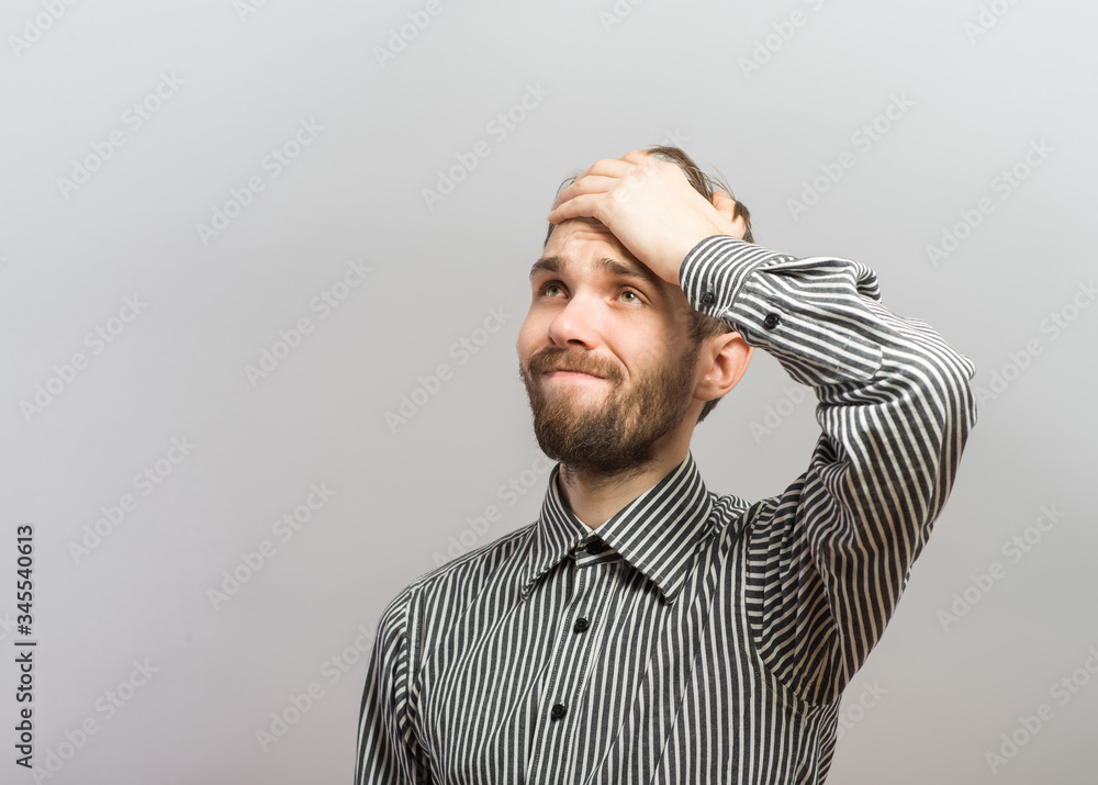 Closeup portrait, goofy, silly young man, slapping hand on head ...