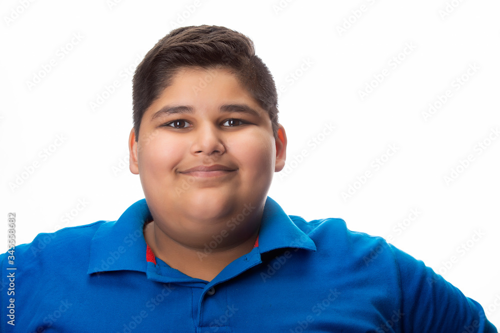 Portrait of a chubby boy smiling. (Obesity) Stock Photo | Adobe Stock