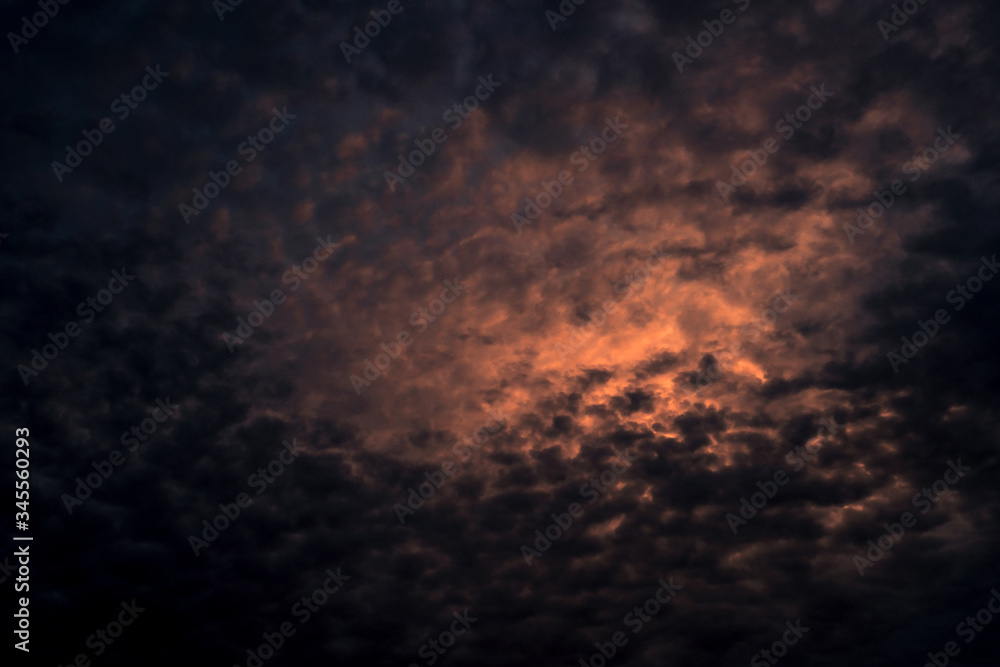 Red light of sun in dark cloudy sunset sky. Dramatic sky with beautiful ...