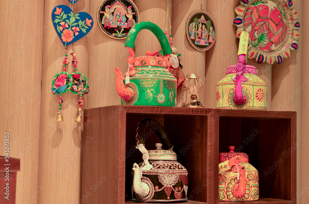 Painted colorful decorative traditional Indian kettles, dreamcatchers ...