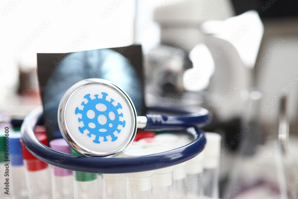 Medical stethoscope lying on set of vials at scientific lab Stock Photo ...