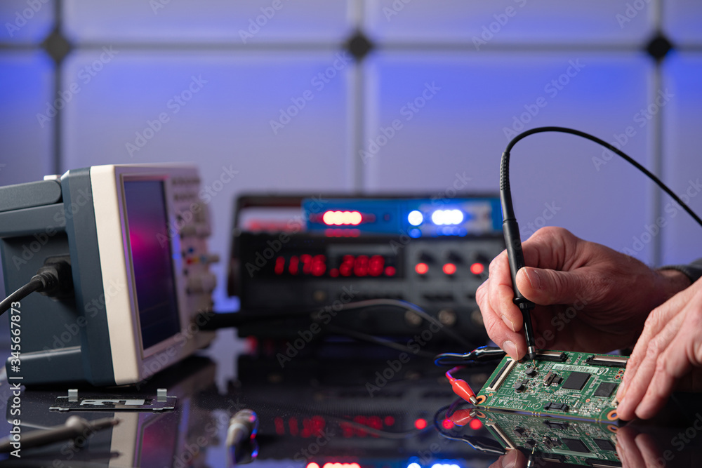 Debugging electronics device. PCB witch microcontroller in electronics laboratory Stock Photo ...