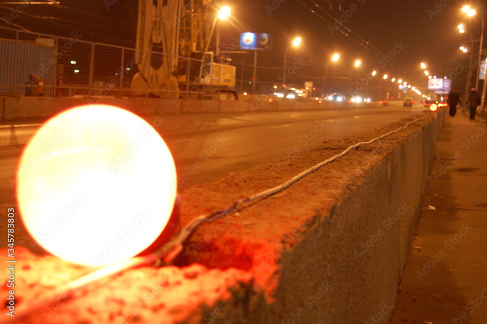Traffic lights at night. Construction site red lamp. Repair lights on ...