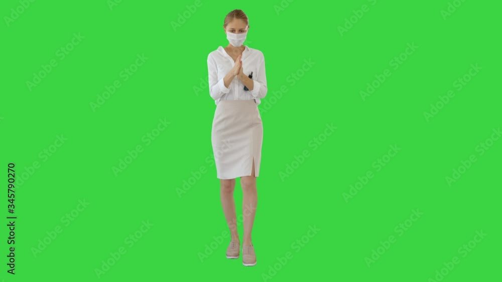Young woman use the skin sanitizer to protect her hands from any ...