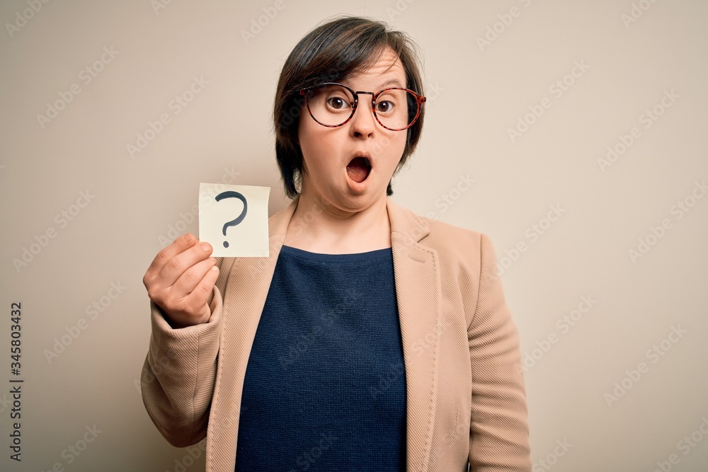 Young down syndrome business woman holding question mark paper as doubt ...