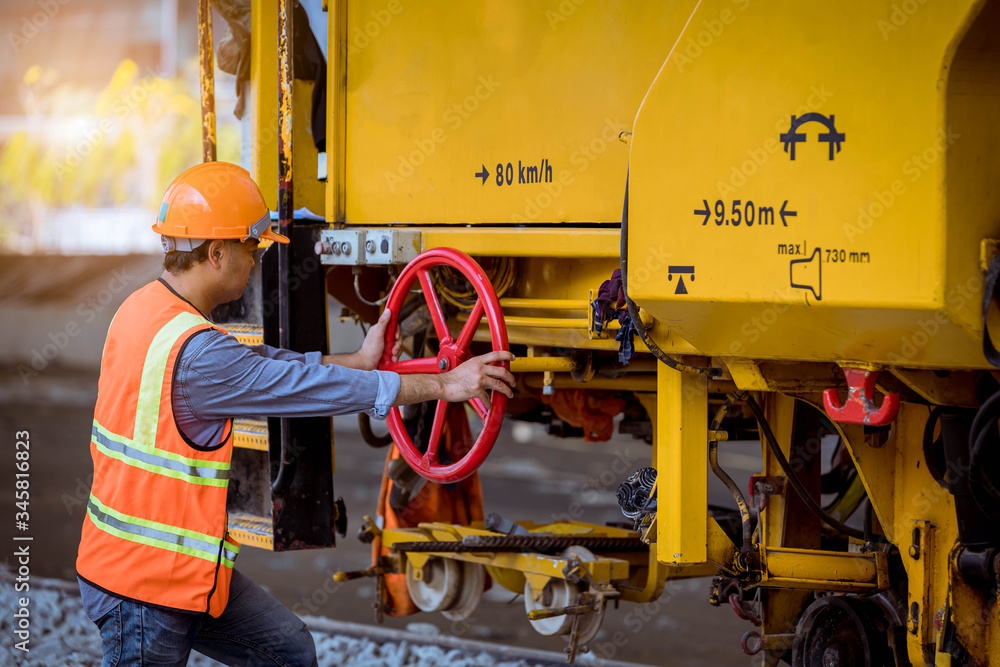 A Engineer under inspection checking head train and railway switch and ...