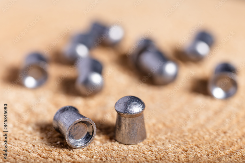 Lead bullets for an air rifle on a tree cut Stock-Foto | Adobe Stock
