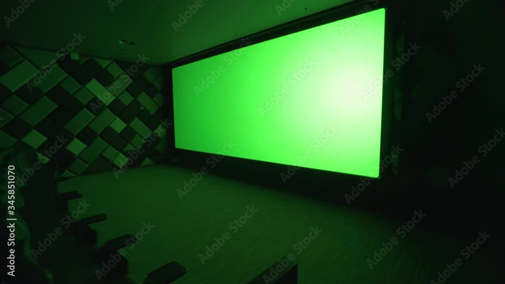 Modern cinema, view of the big green screen in the cinema hall ...
