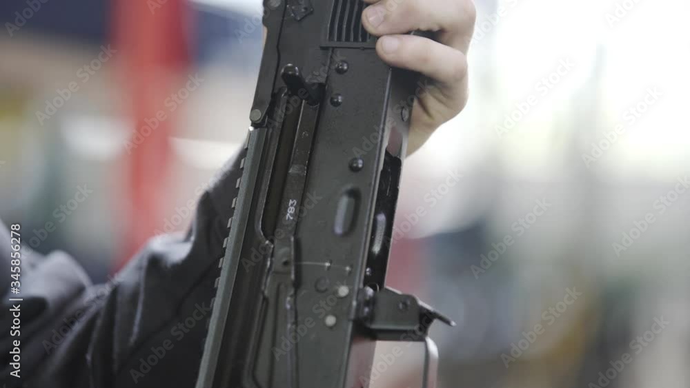 Factory assembly of a Kalashnikov assault rifle. Close up of charging ...