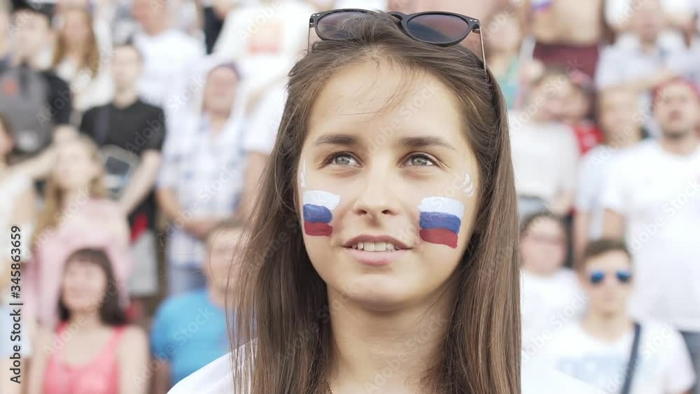 Video Stock Portrait of Pretty Female football fan sings Russian ...