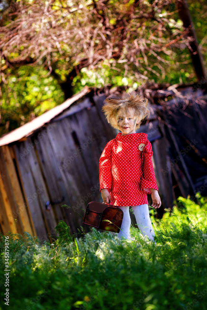 Domovenok Kuzya portrait stands against the background of a collapsed ...
