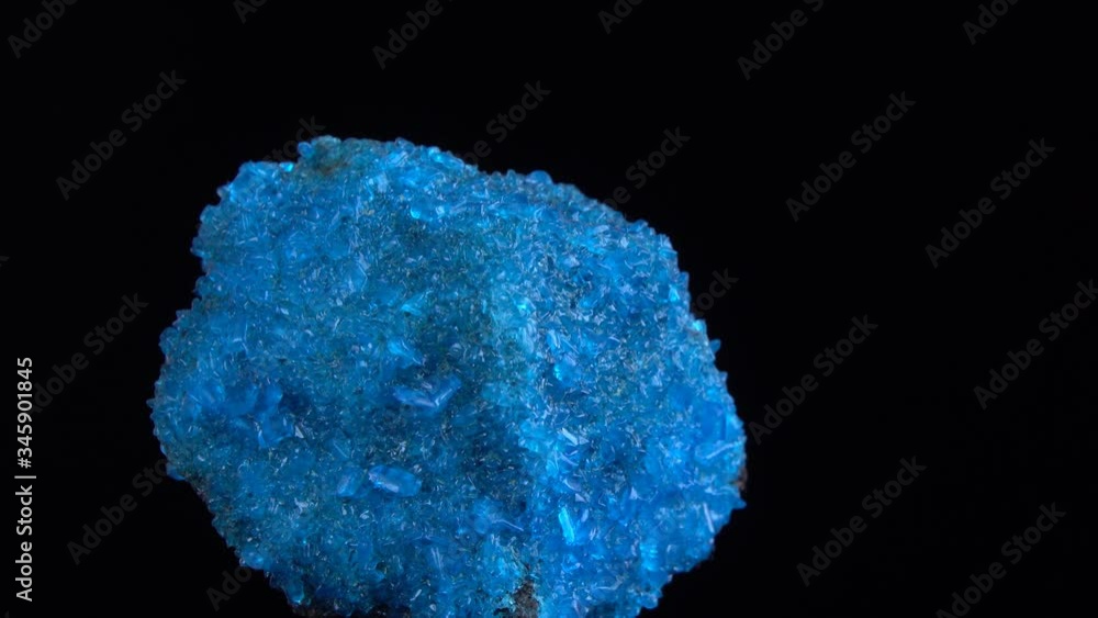Blue Covelline or Covellite Crystals slowly rotates on a black ...