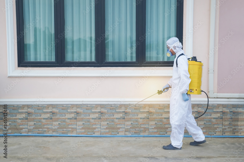 Specialist man in hazmat suits cleaning disinfecting coronavirus cells ...