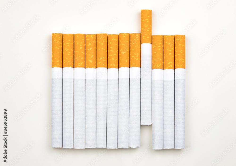 Long row of cigarettes with orange filter tips Stock Photo | Adobe Stock