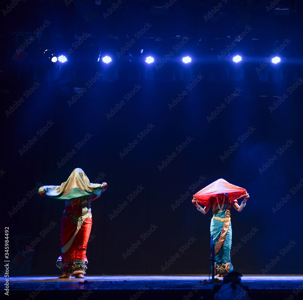 Dancers doing the Mujra in the popular Maharashtrian Folk dance form ...