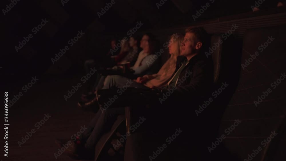Movie theater, people watching movies in the cinema, portraits of ...