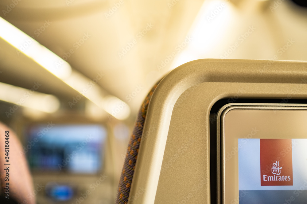 DUBAI- Emirates A380 interior view of seat screen and Emirates logo ...