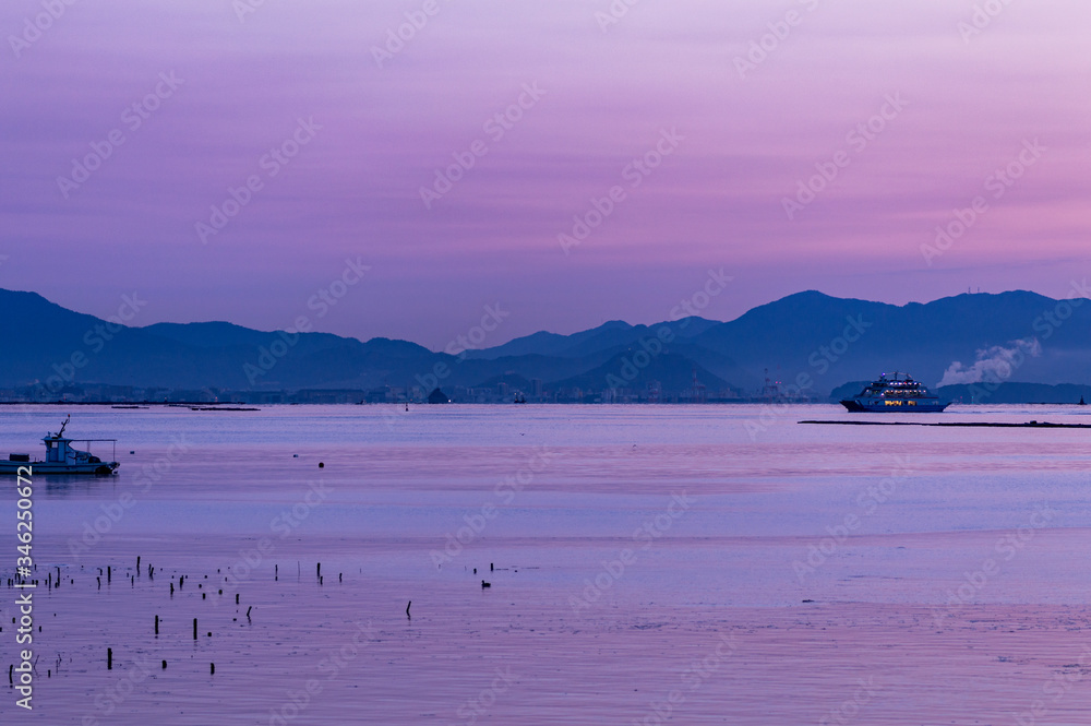 Beautiful purple dawn sunrise over Hiroshima bay, Seto Inland sea of ...