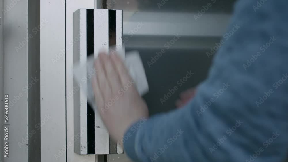 Sterilize storefront for small business. Disinfecting with wipe for ...