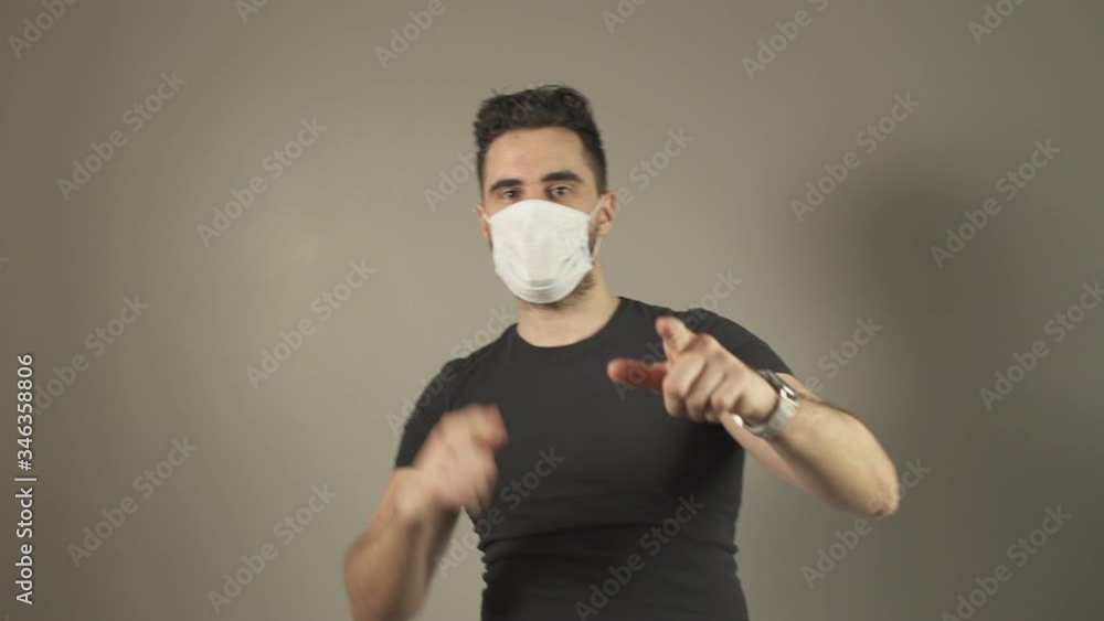 Isolated happy man with surgical Mask, brown hair and eyes, dancing and ...