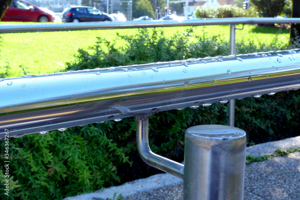 sloped concrete handicap access ramp with stainless steel handrail and ...