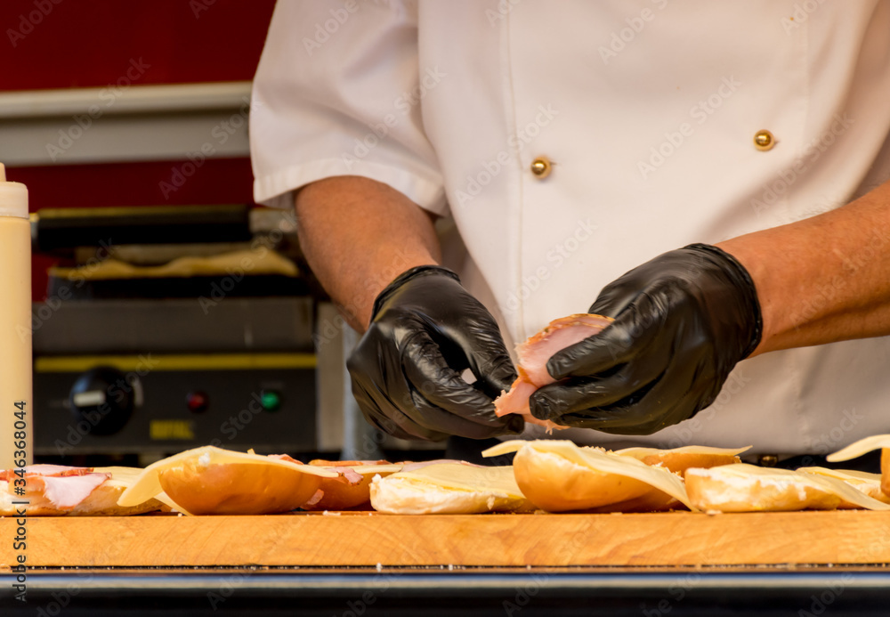 Chef preparing subway sandwich, live cooking session. Fast food ...