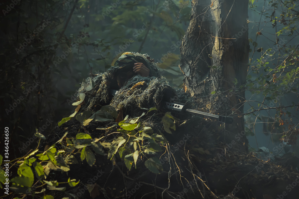 soldier with a rifle.Army soldier in protective uniform holding rifle ...