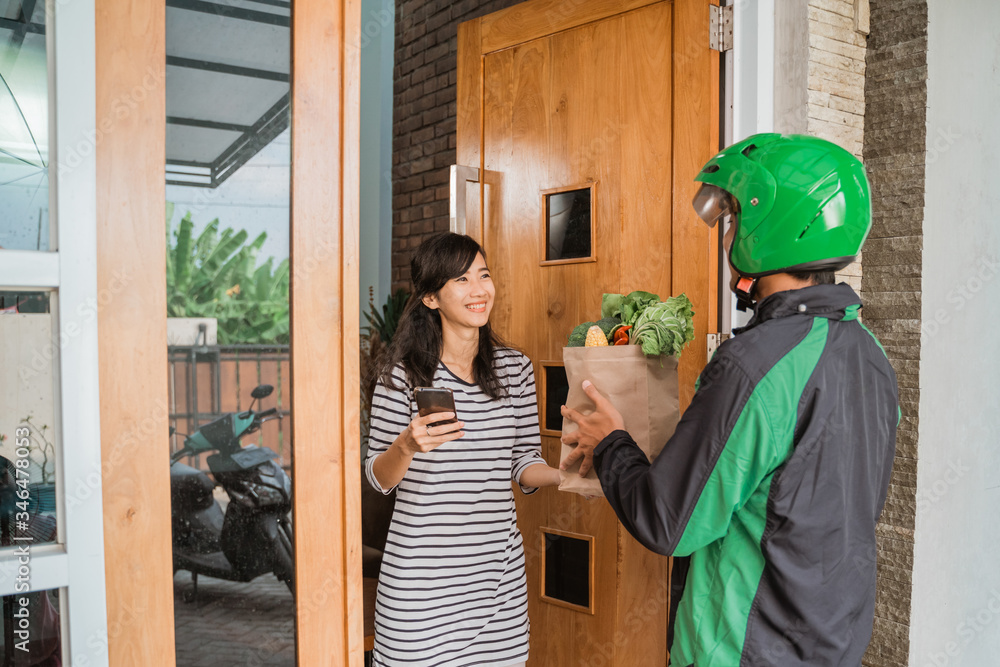 grocery online shopping. asian man delivering food to customer Stock ...
