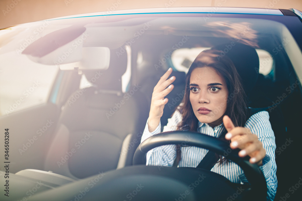 Road rage! Enraged young woman driver shouts and points accusingly ...