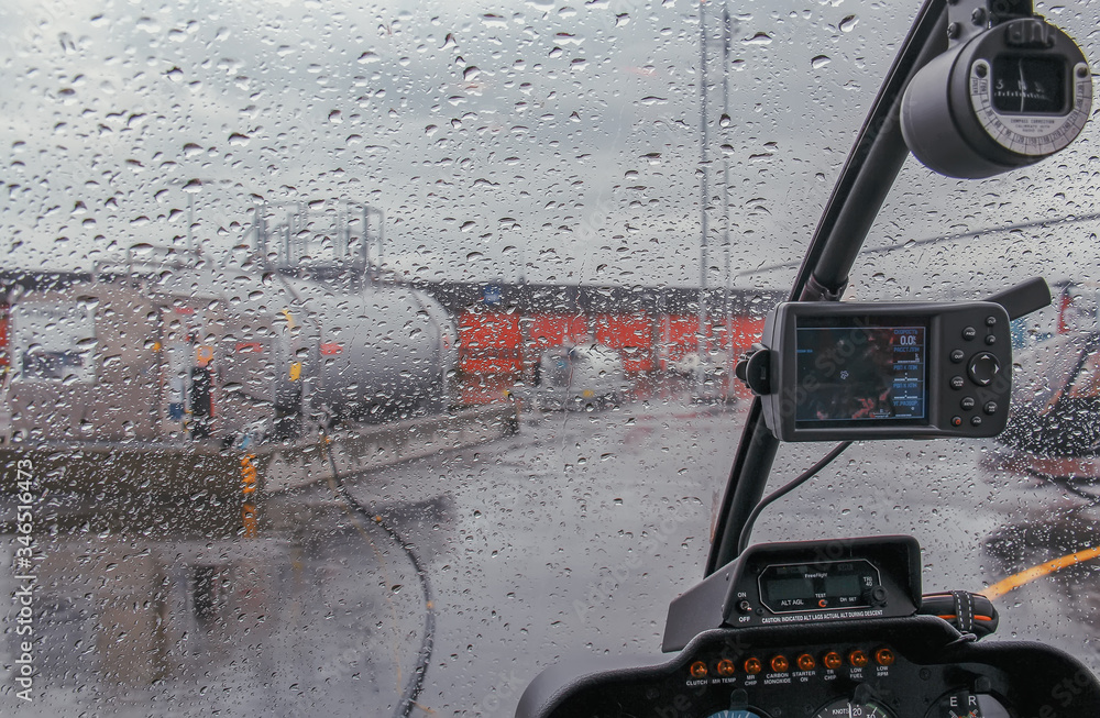 Rainy day. The view from the cockpit of the helicopter Stock Photo ...