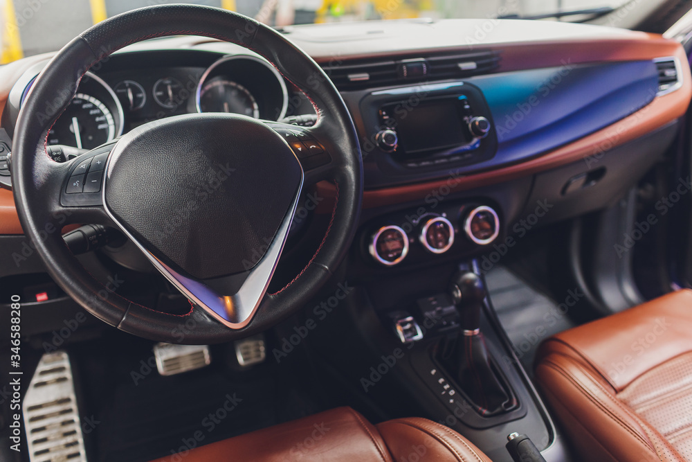 Dark luxury car Interior - steering wheel, shift lever and dashboard ...