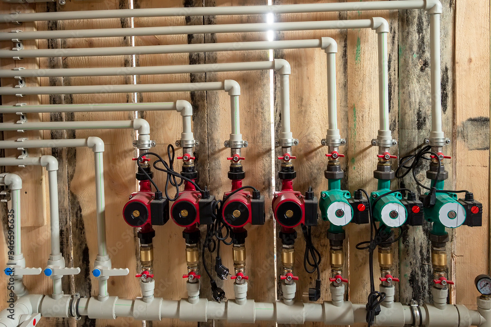 Distribution header of the heating system in the boiler room, with ...