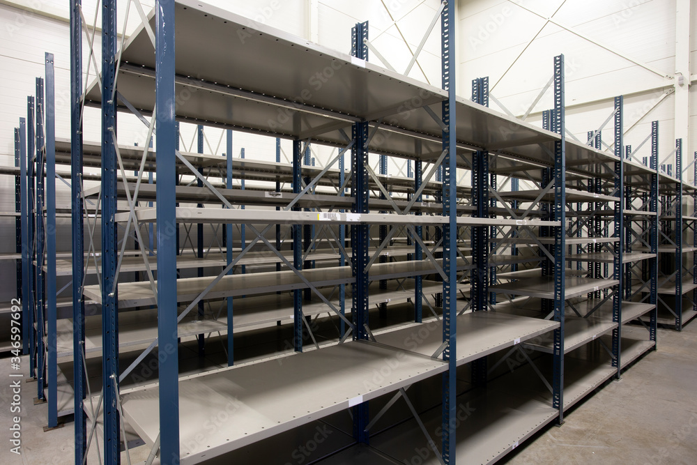 huge warehouse with empty racks inside for storage modern design, metal ...