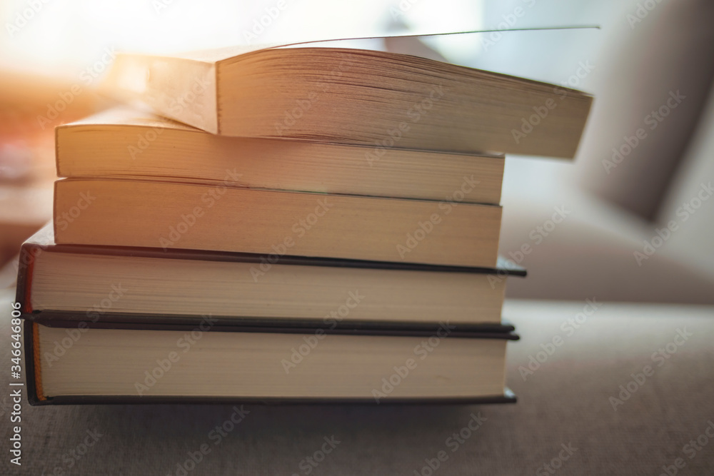 Stack of books on light background. Book stack in the library room and ...