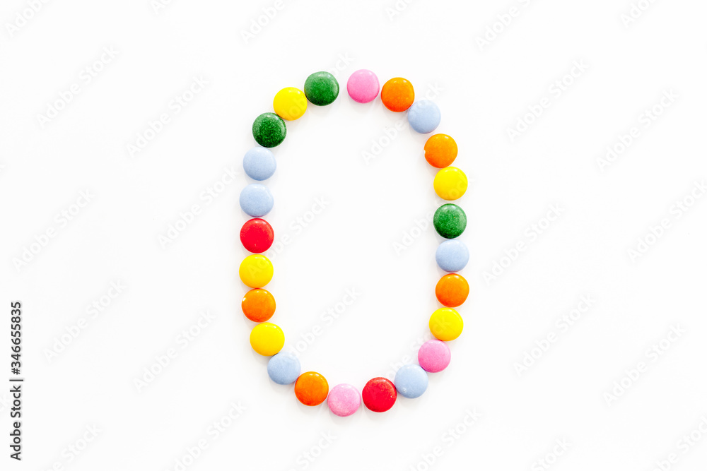 Number 0 - zero - lined with sweets on isolated top-down Stock Photo ...