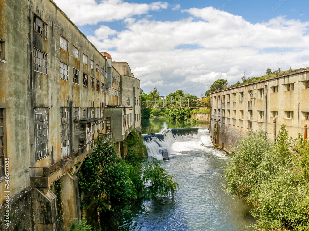Old paper factory near river with waterfalls. Nabao River, Matrena ...