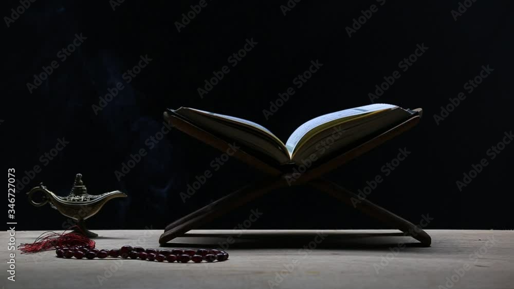 Quran in the mosque - open for prayers The black background of the ...