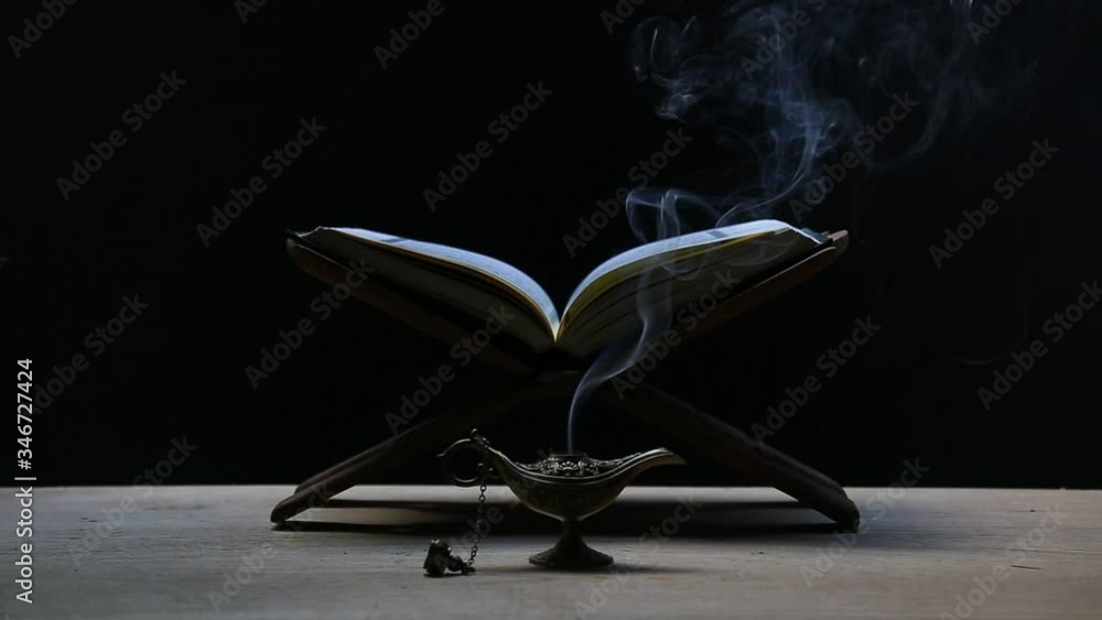 Quran in the mosque - open for prayers The black background of the ...