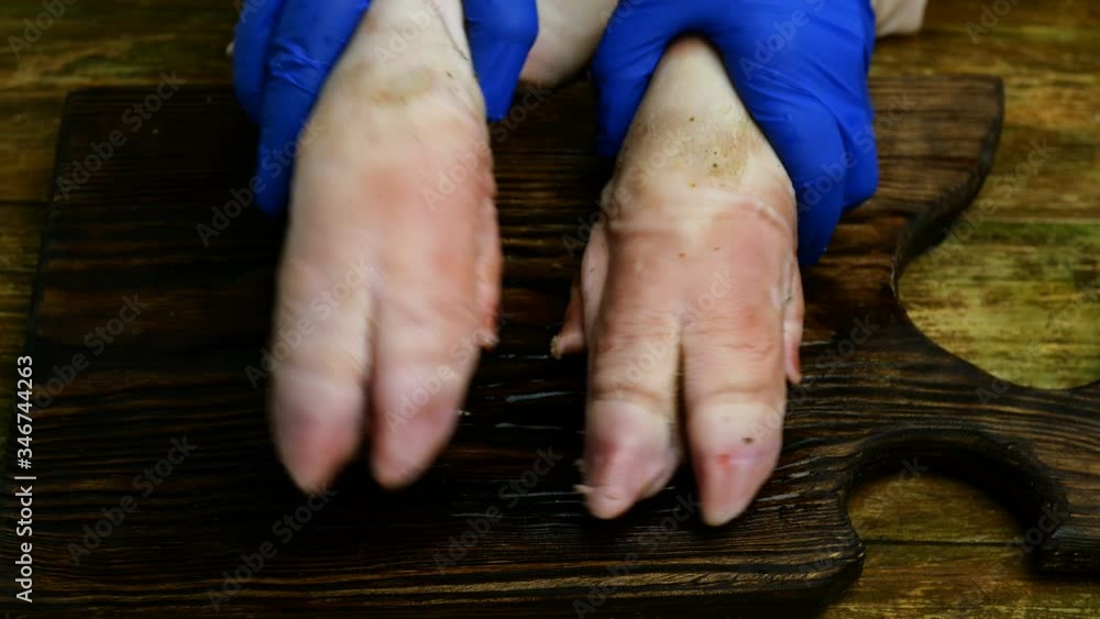 Preparation pork legs. Step by step. Human hands in rubber gloves funny ...