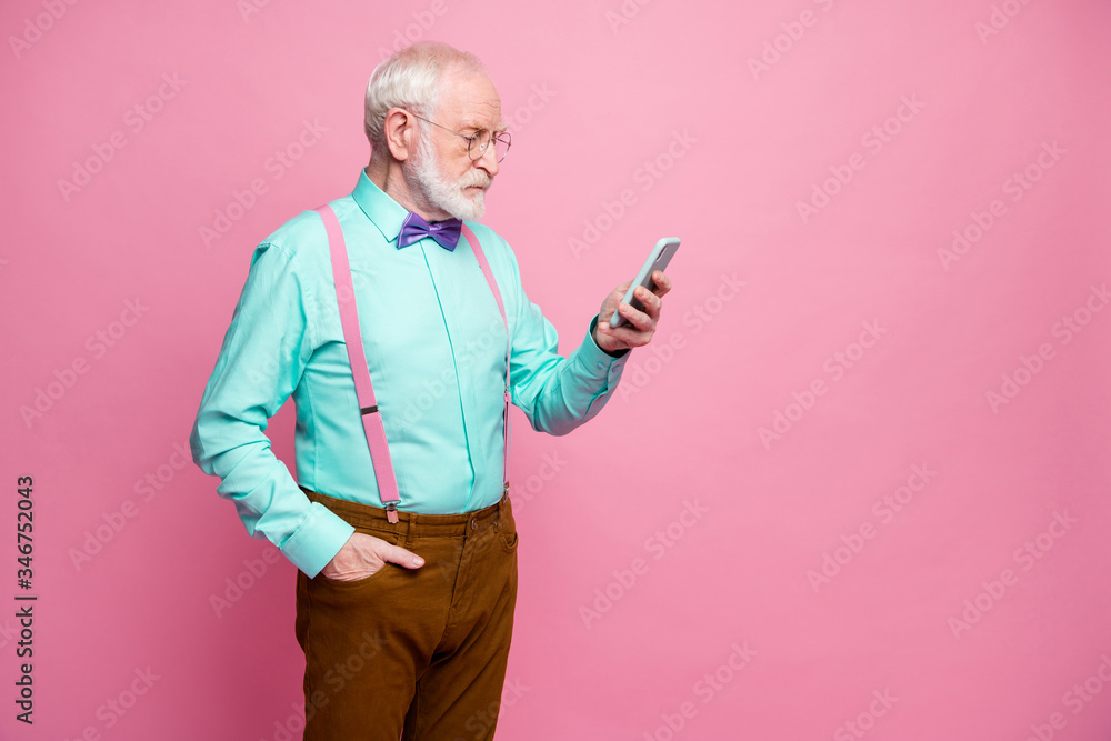 Profile side photo focused old man use smartphone check social network ...