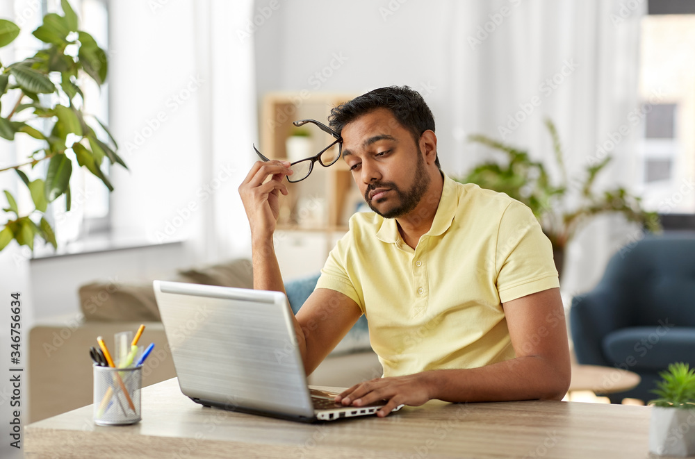 remote job, technology and people concept - bored or tired young indian ...