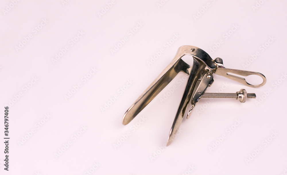 Gynecological mirror on a white background. Copy space. Gynecological ...