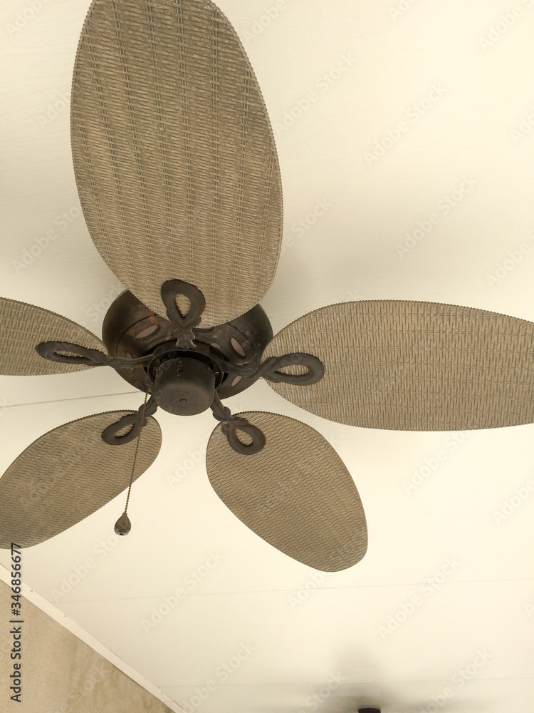 Ceiling fan on white background overhead with big leaf blades Stock ...