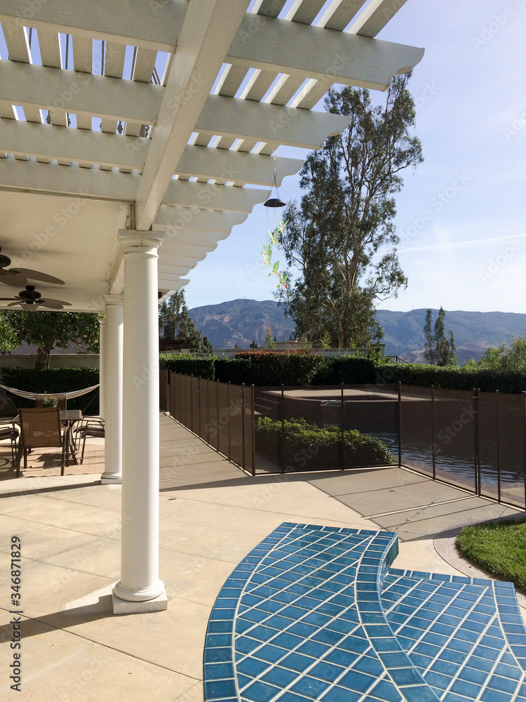 portico awning wooden sun shade ove back porch with slats and blue sky ...